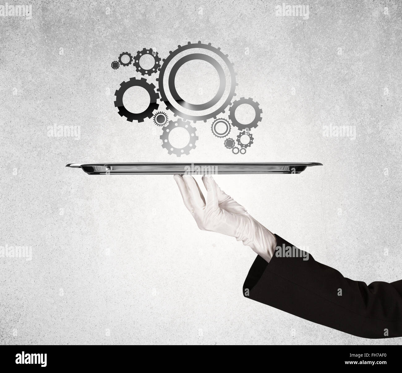 Working cog wheel concept on tray Stock Photo - Alamy