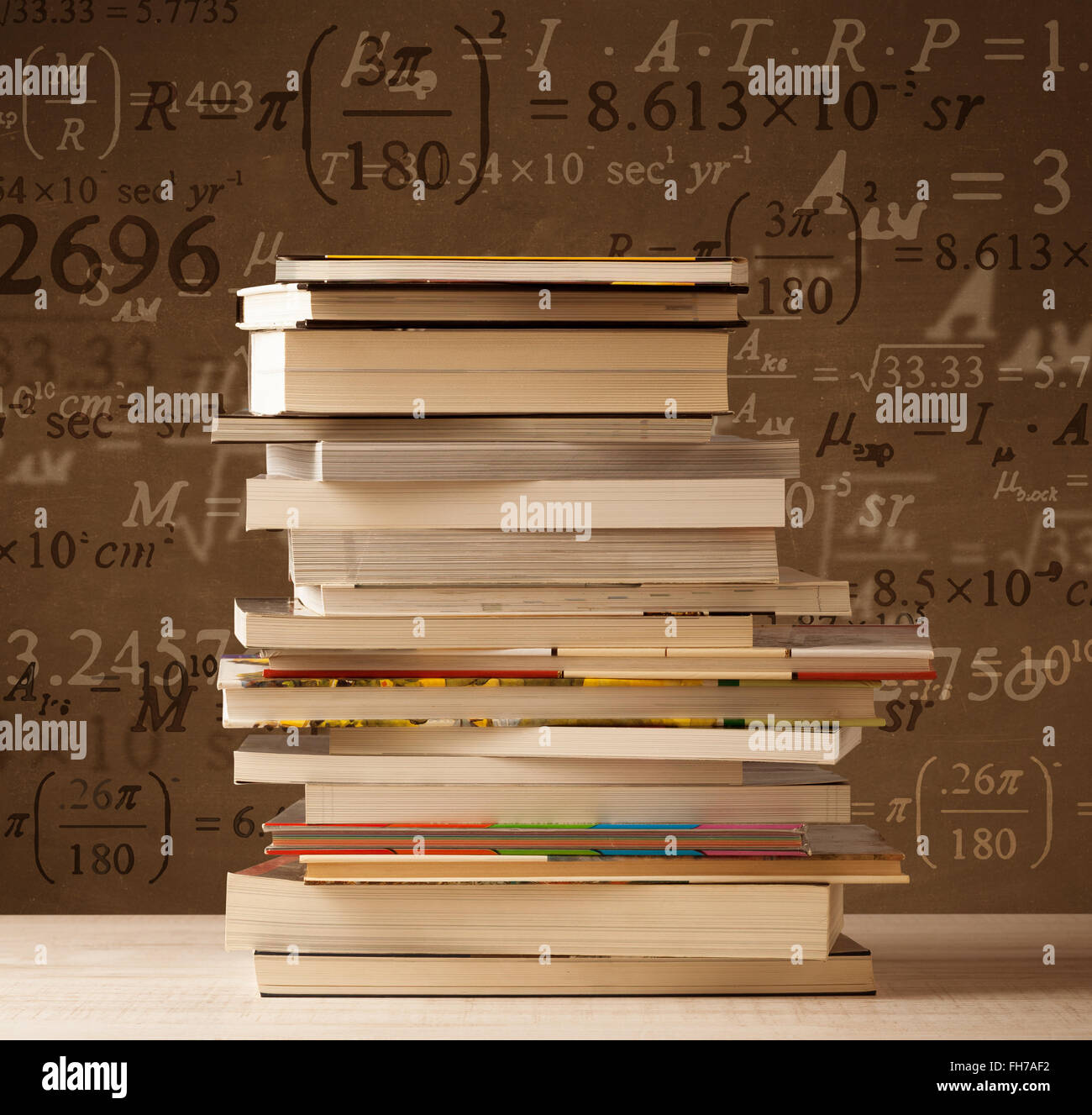 Books on vintage background with math formulas Stock Photo - Alamy