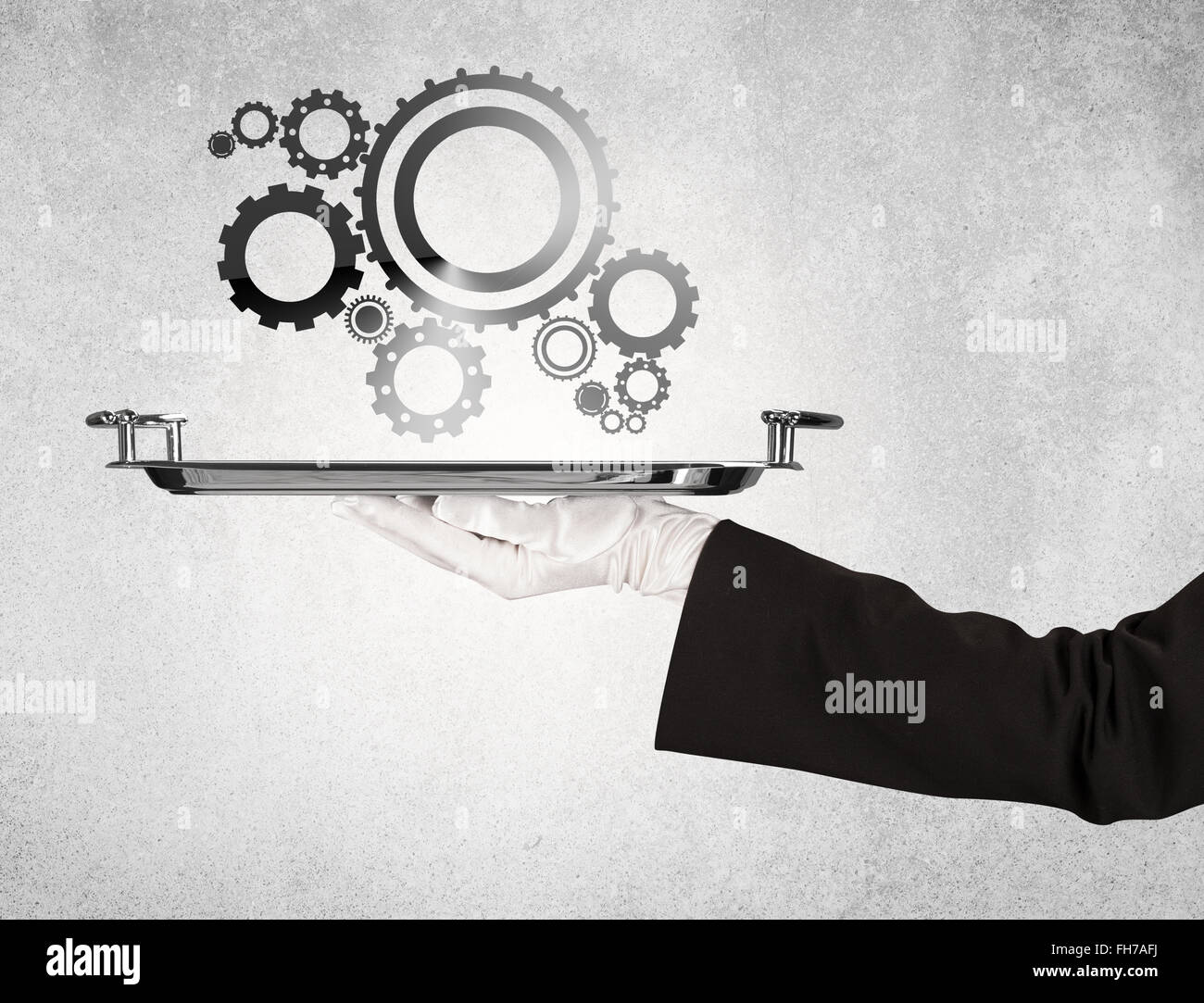 Working cog wheel concept on tray Stock Photo - Alamy