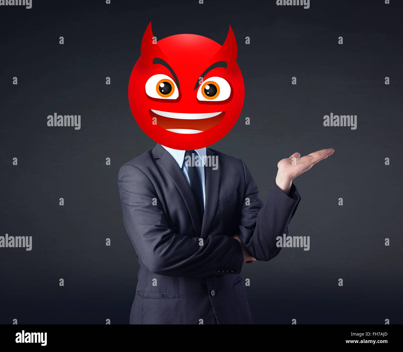 businessman wears devil smiley face Stock Photo - Alamy