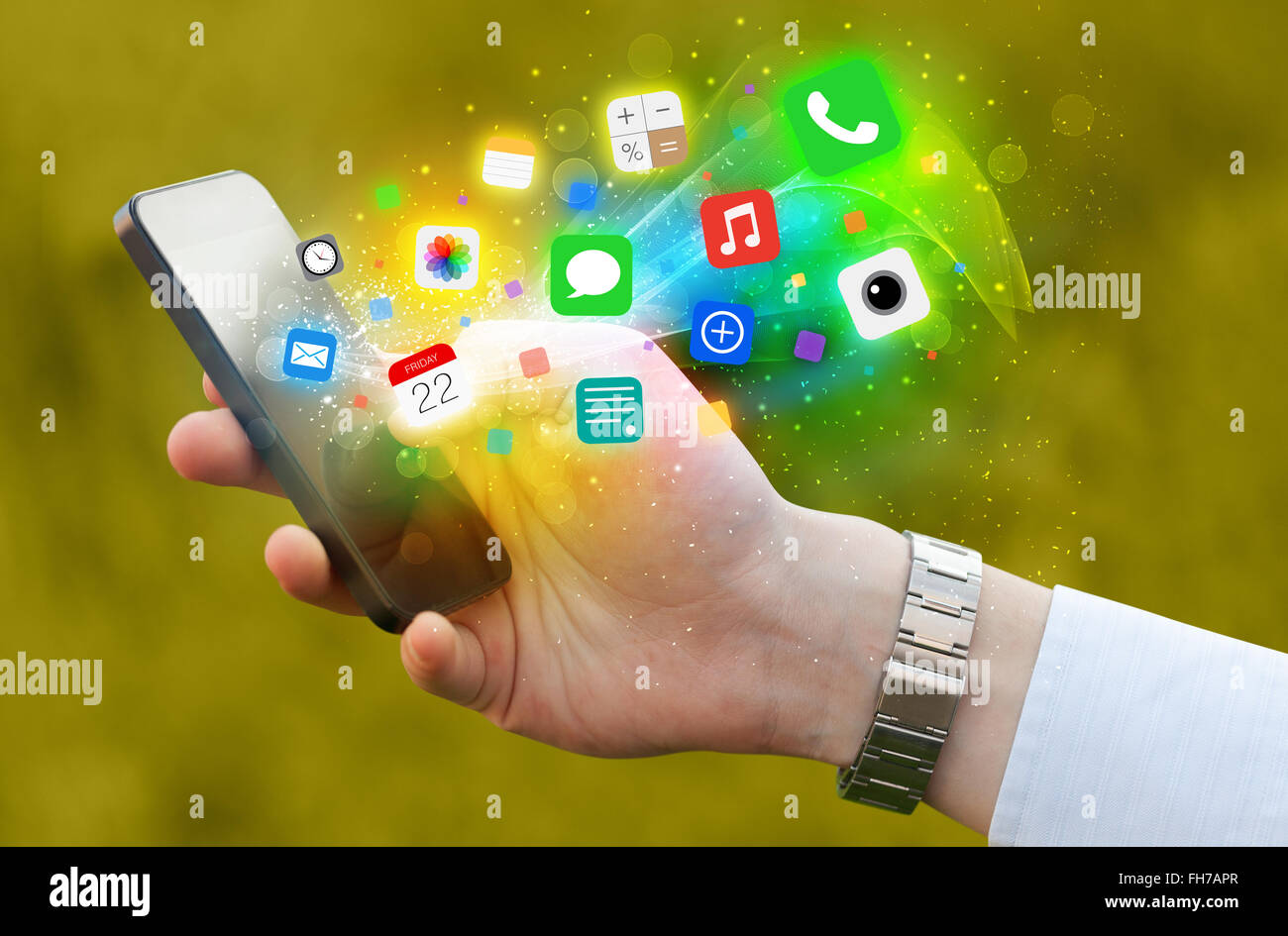 Hand holding smartphone with colorful app icons Stock Photo - Alamy