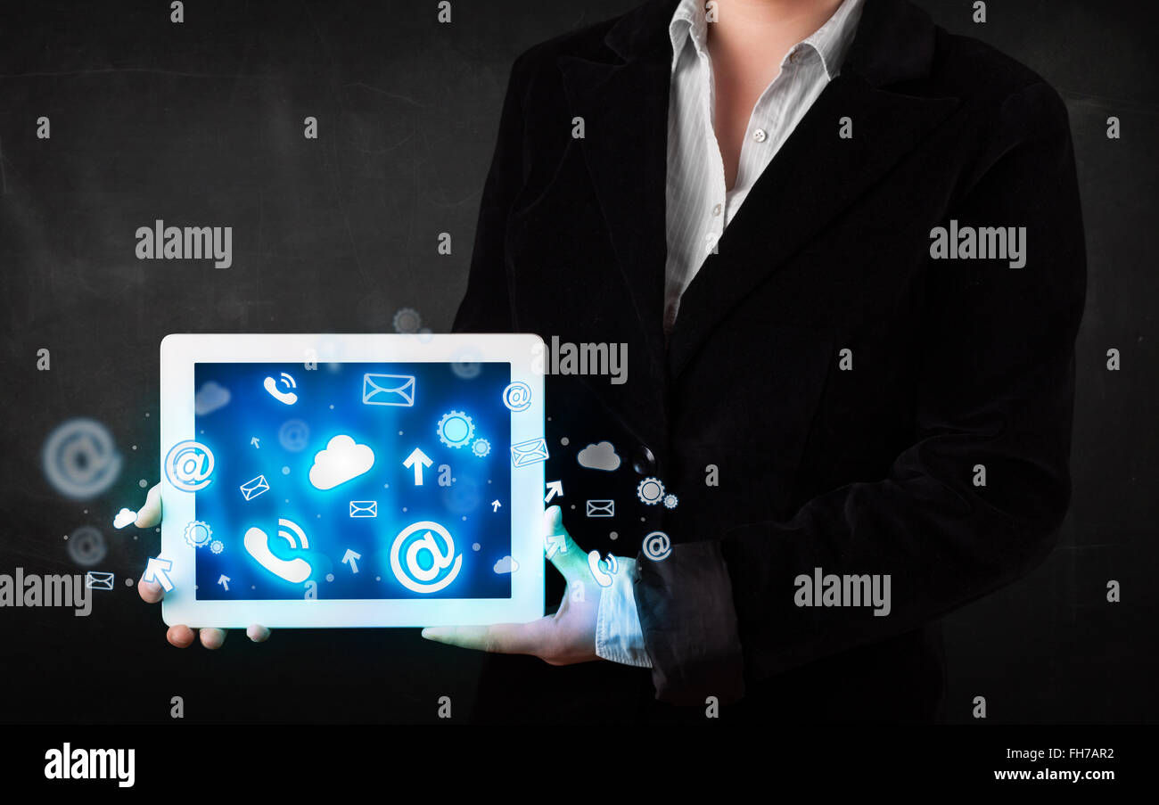 Person holding a tablet with blue technology icons and symbols Stock ...