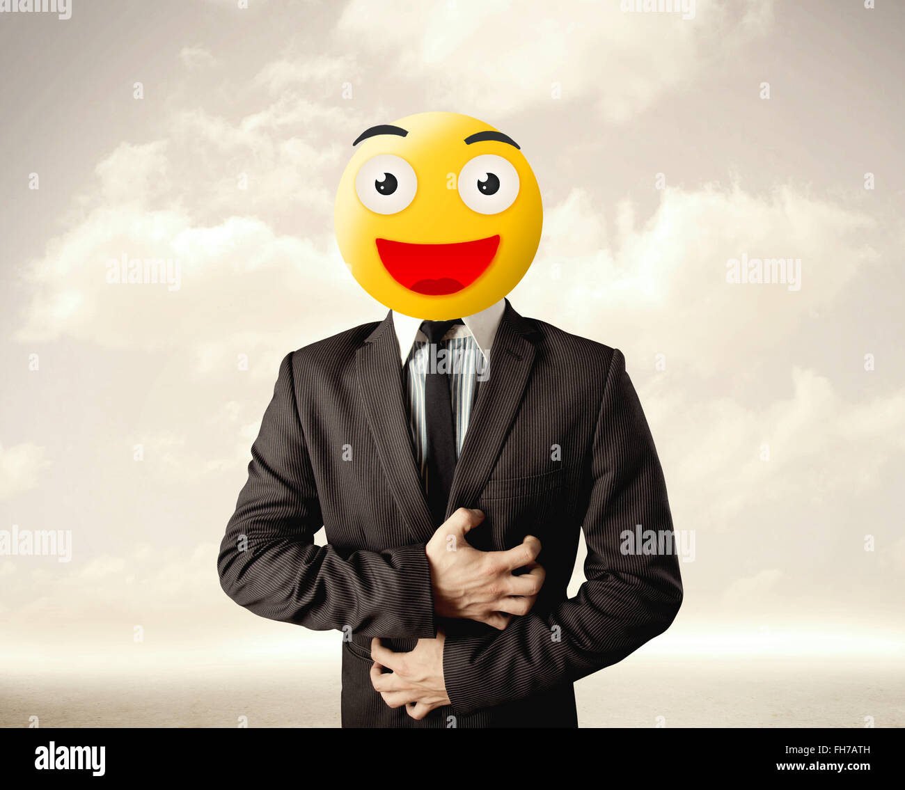 businessman wears yellow smiley face Stock Photo - Alamy