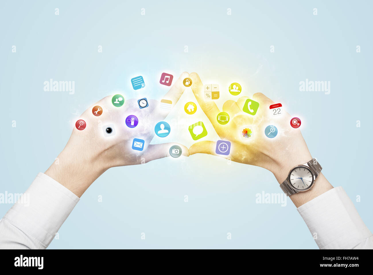 Hands creating a form with mobile app icons Stock Photo - Alamy