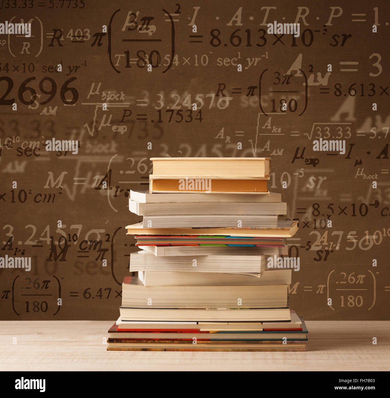 Books on vintage background with math formulas Stock Photo - Alamy