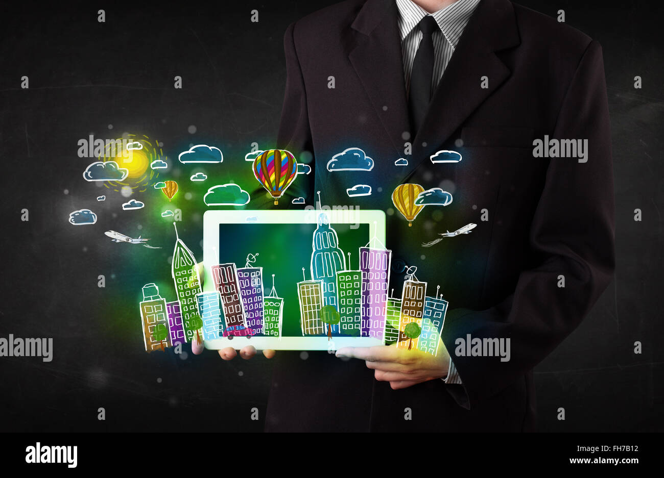 Young person showing tablet with hand drawn cityscape Stock Photo - Alamy
