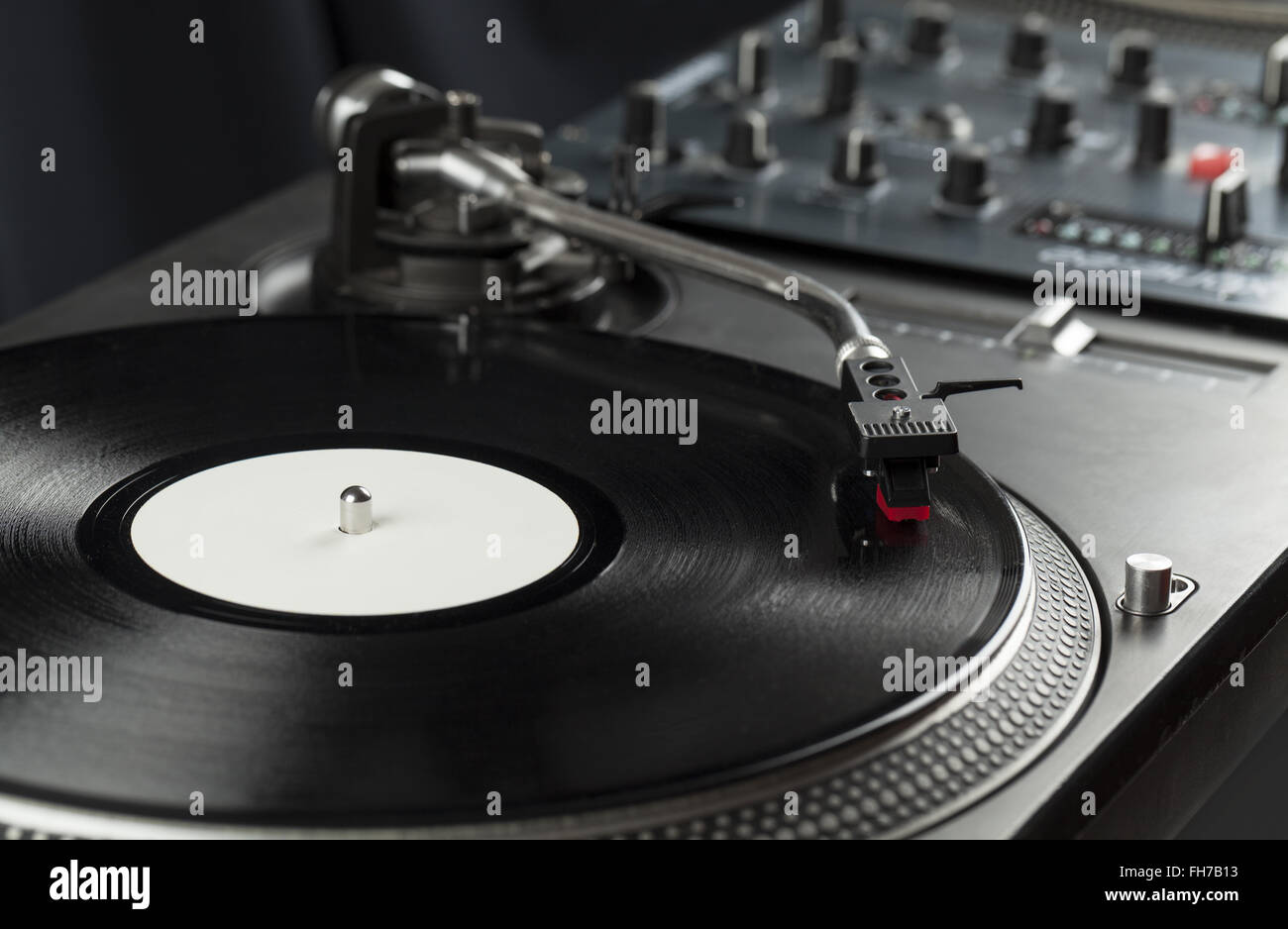 Turntable playing vinyl close up with needle on the record Stock Photo ...