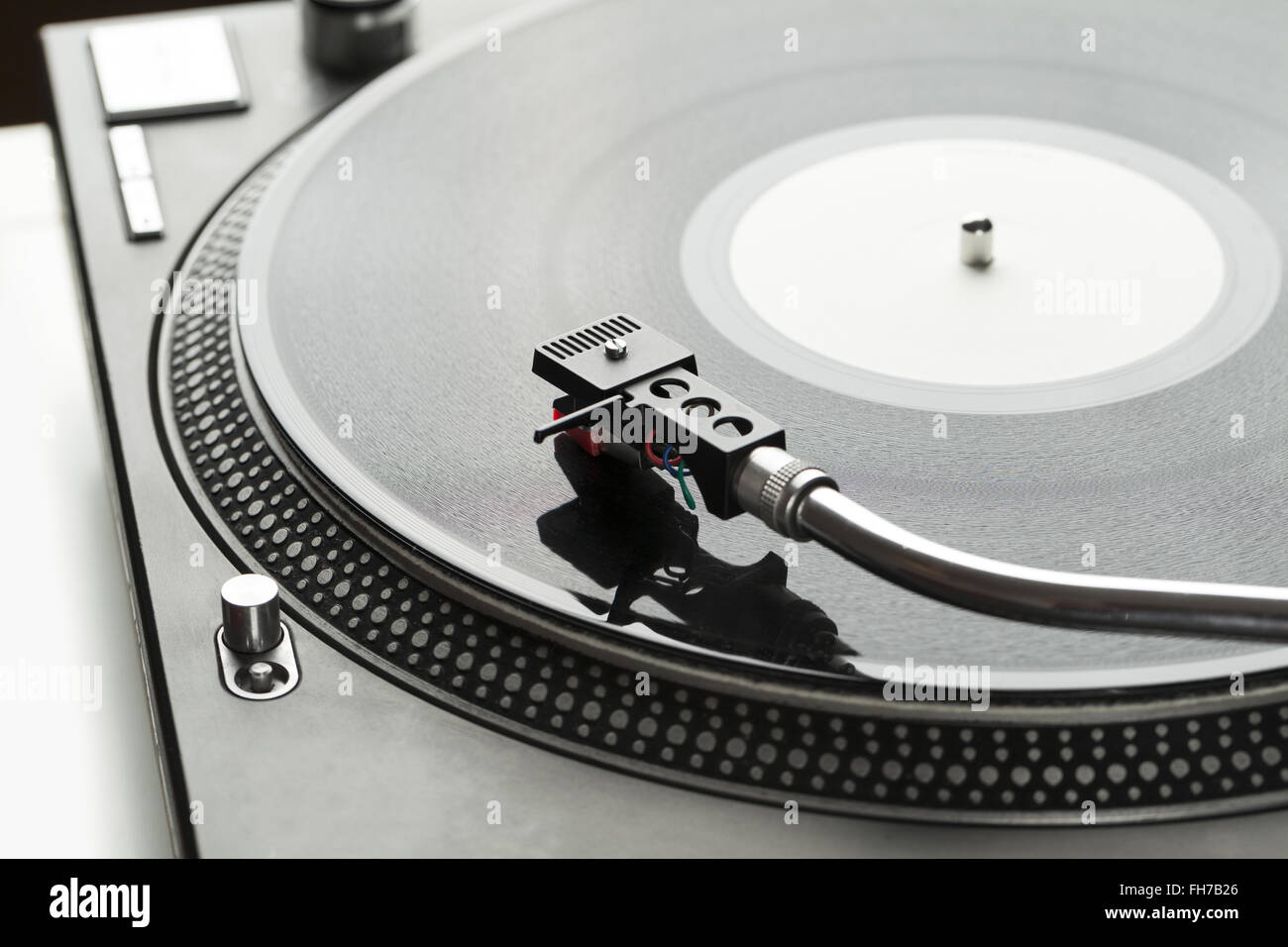 Turntable playing vinyl close up with needle on the record Stock Photo ...