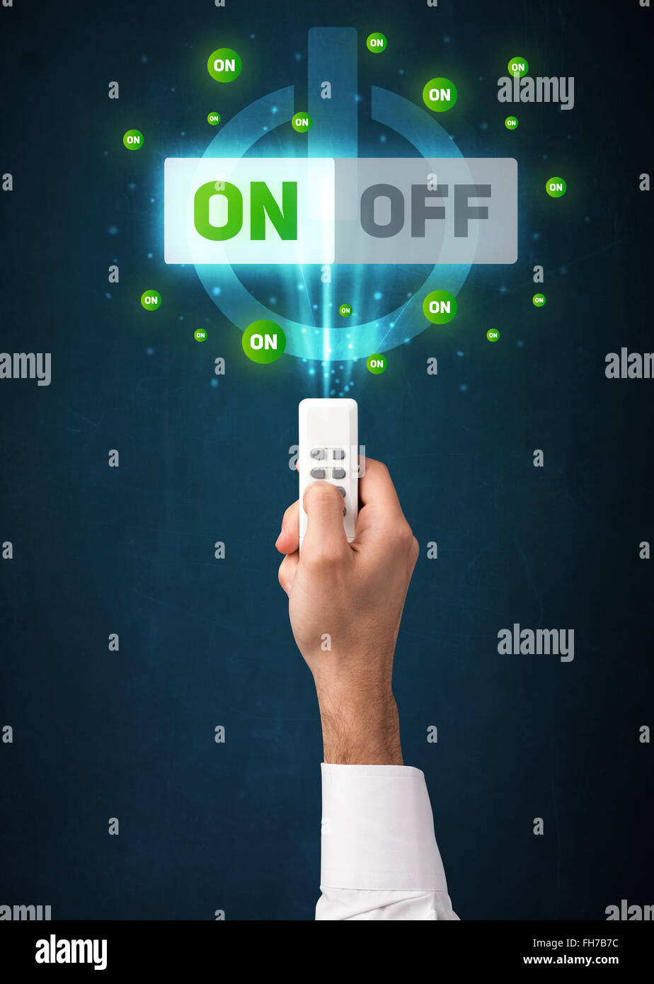 Hand with remote control and on-off signals Stock Photo - Alamy