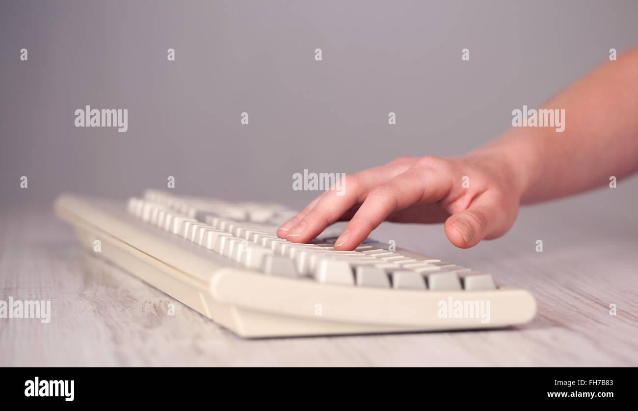 Close up of hand pressing keyboard buttons Stock Photo - Alamy
