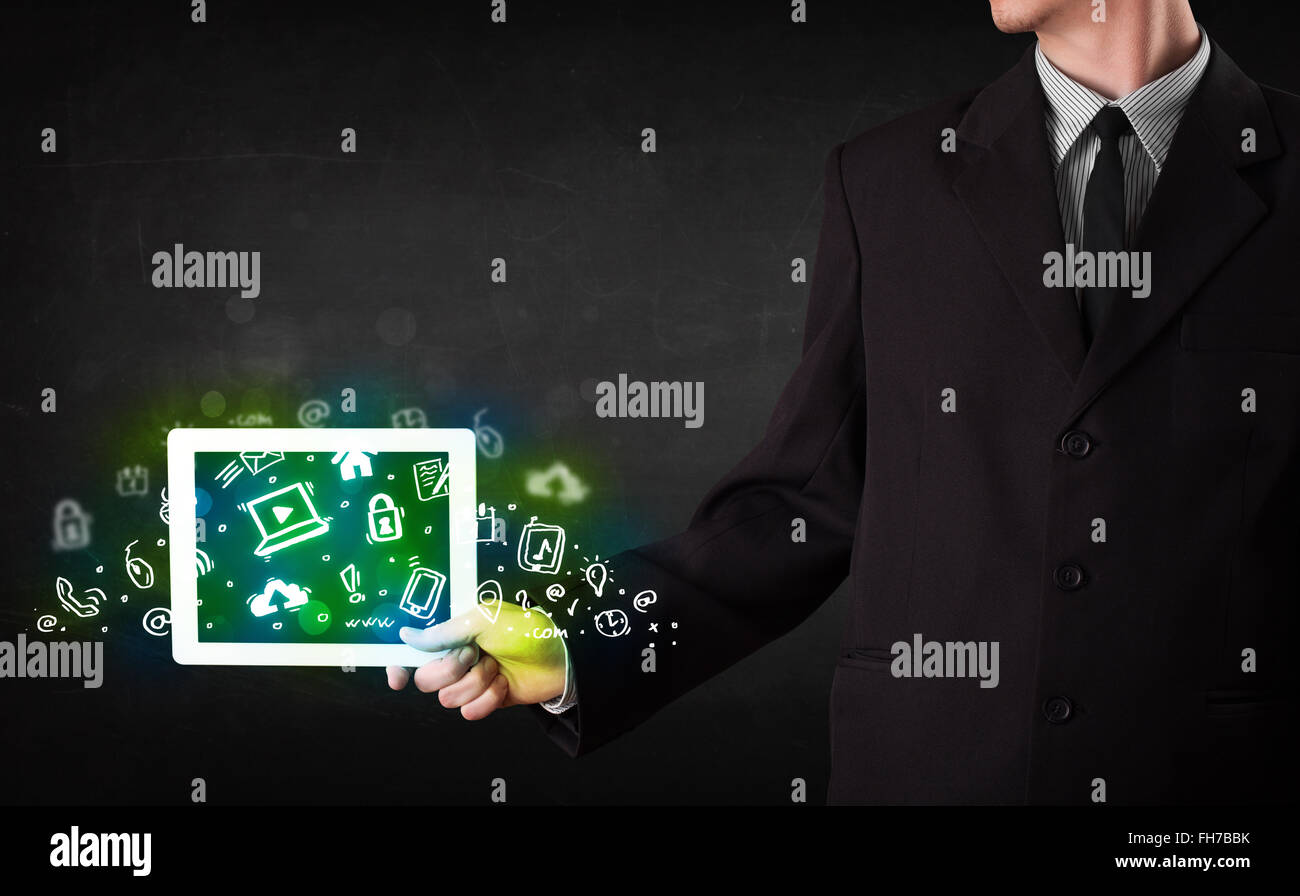 Person holding tablet with green media icons and symbols Stock Photo ...