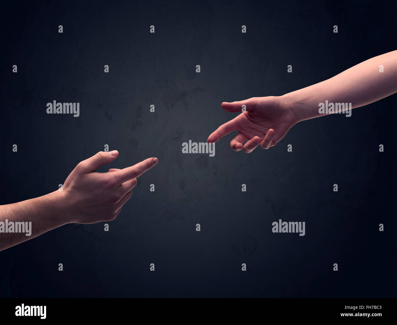 Hand about to touch another one Stock Photo - Alamy