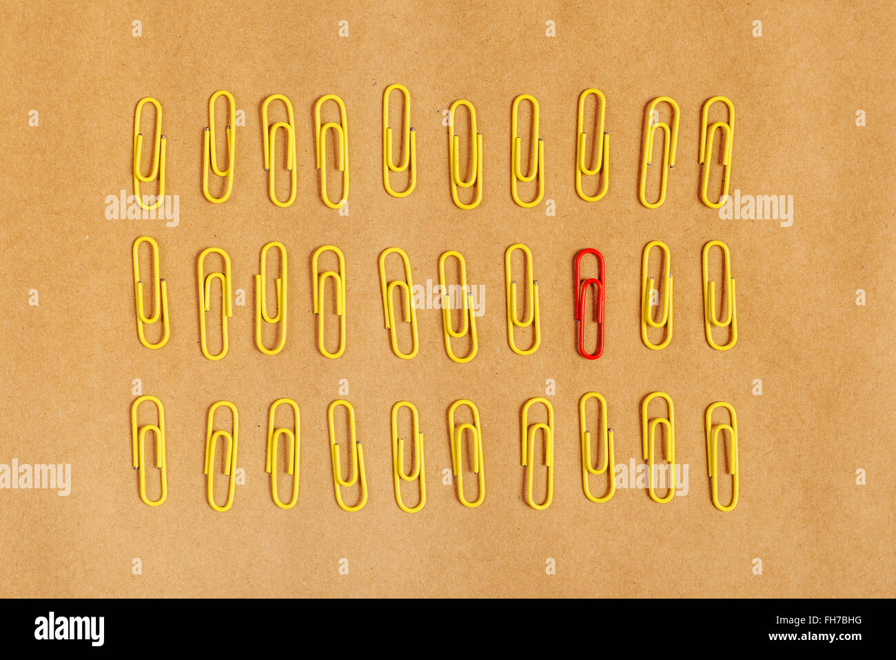 Flat lay colorful paper clips arrangement on kraft paper background ...