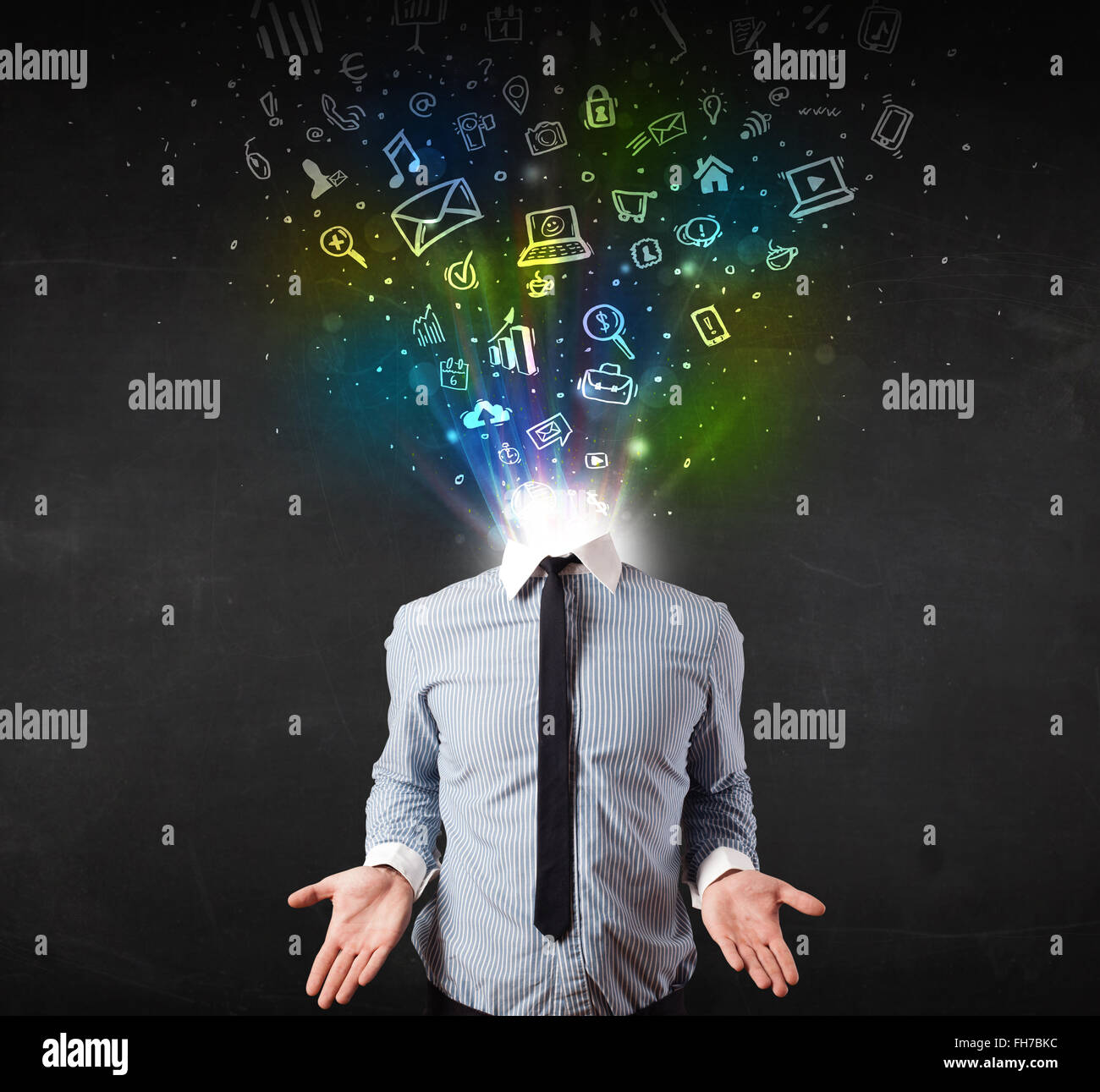 Business man with glowing media icons exploding head Stock Photo - Alamy