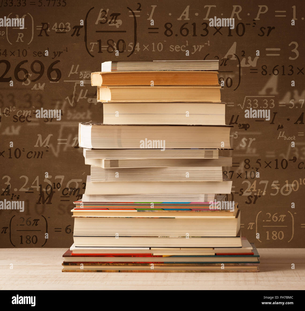 Books on vintage background with math formulas Stock Photo - Alamy