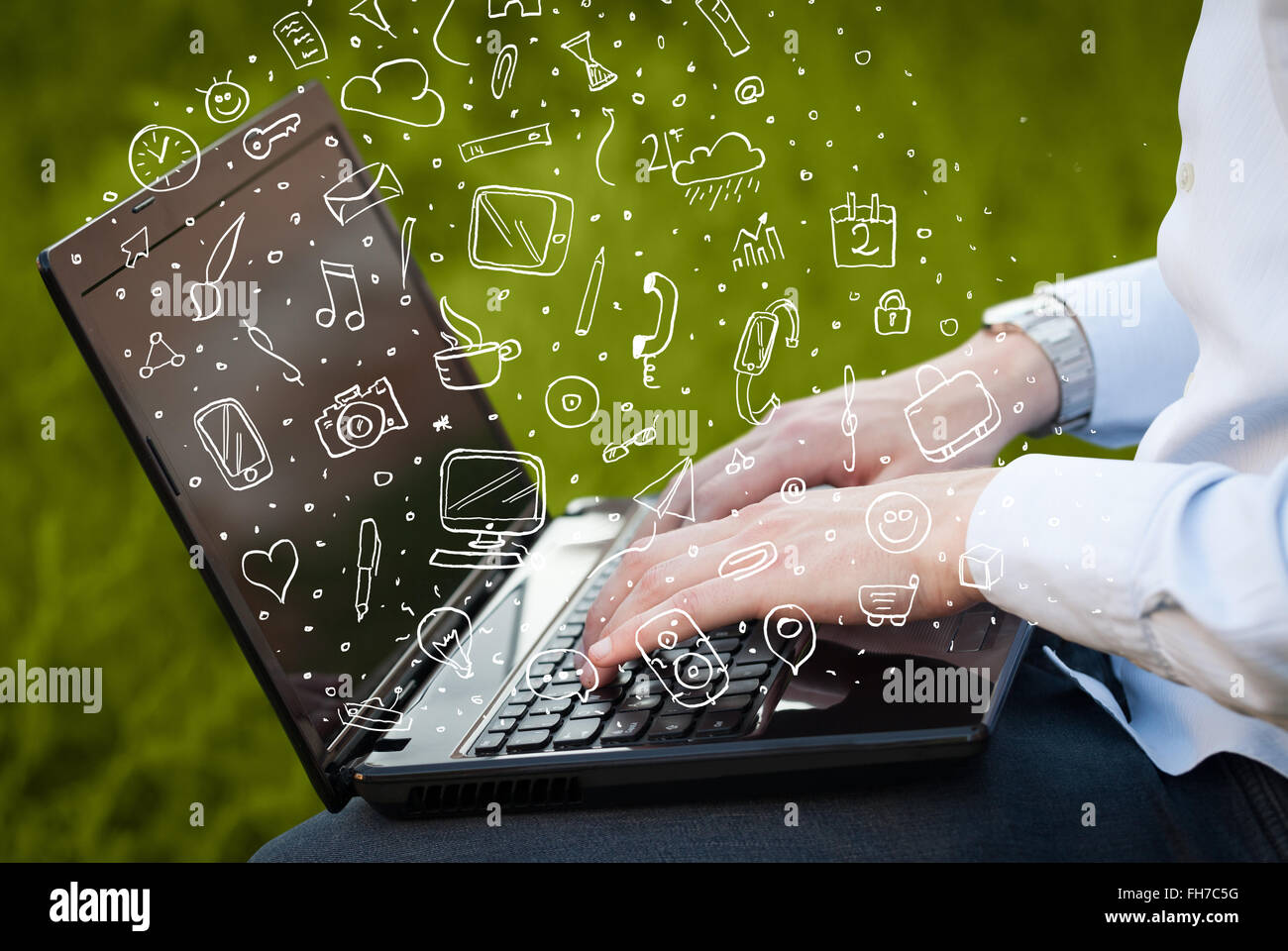 Laptop computer wtih hand drawn icons and symbols Stock Photo - Alamy