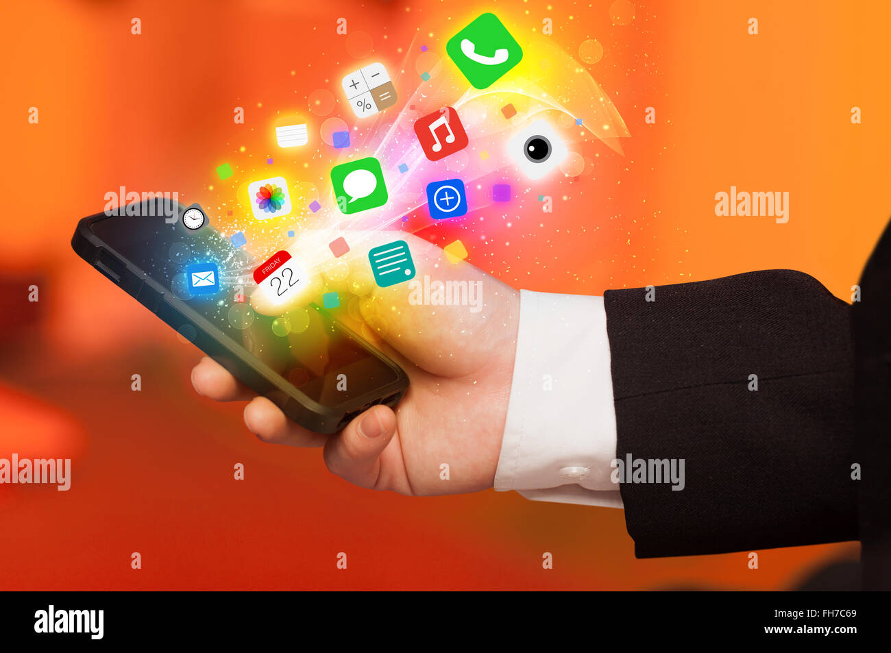 Hand holding smartphone with colorful app icons Stock Photo - Alamy