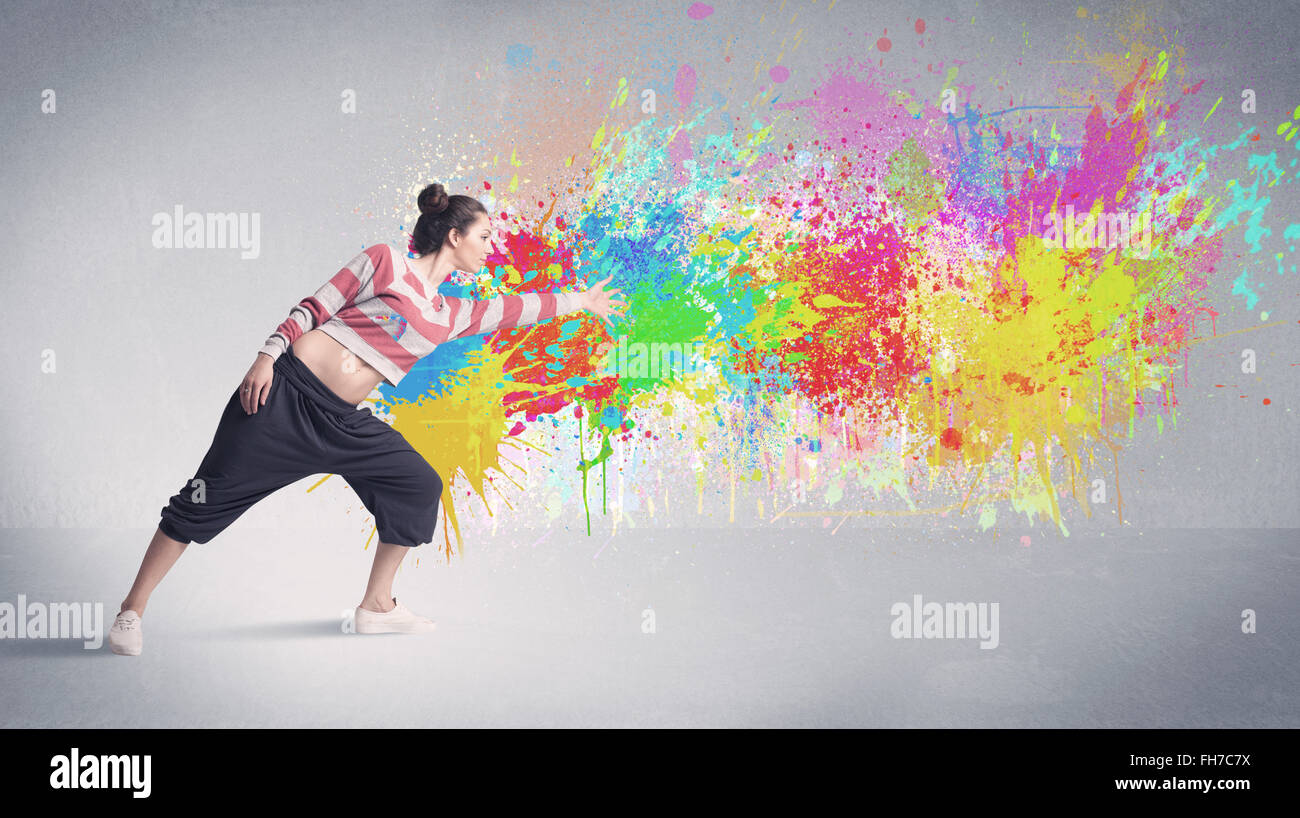 Young colorful street dancer with paint splash Stock Photo - Alamy