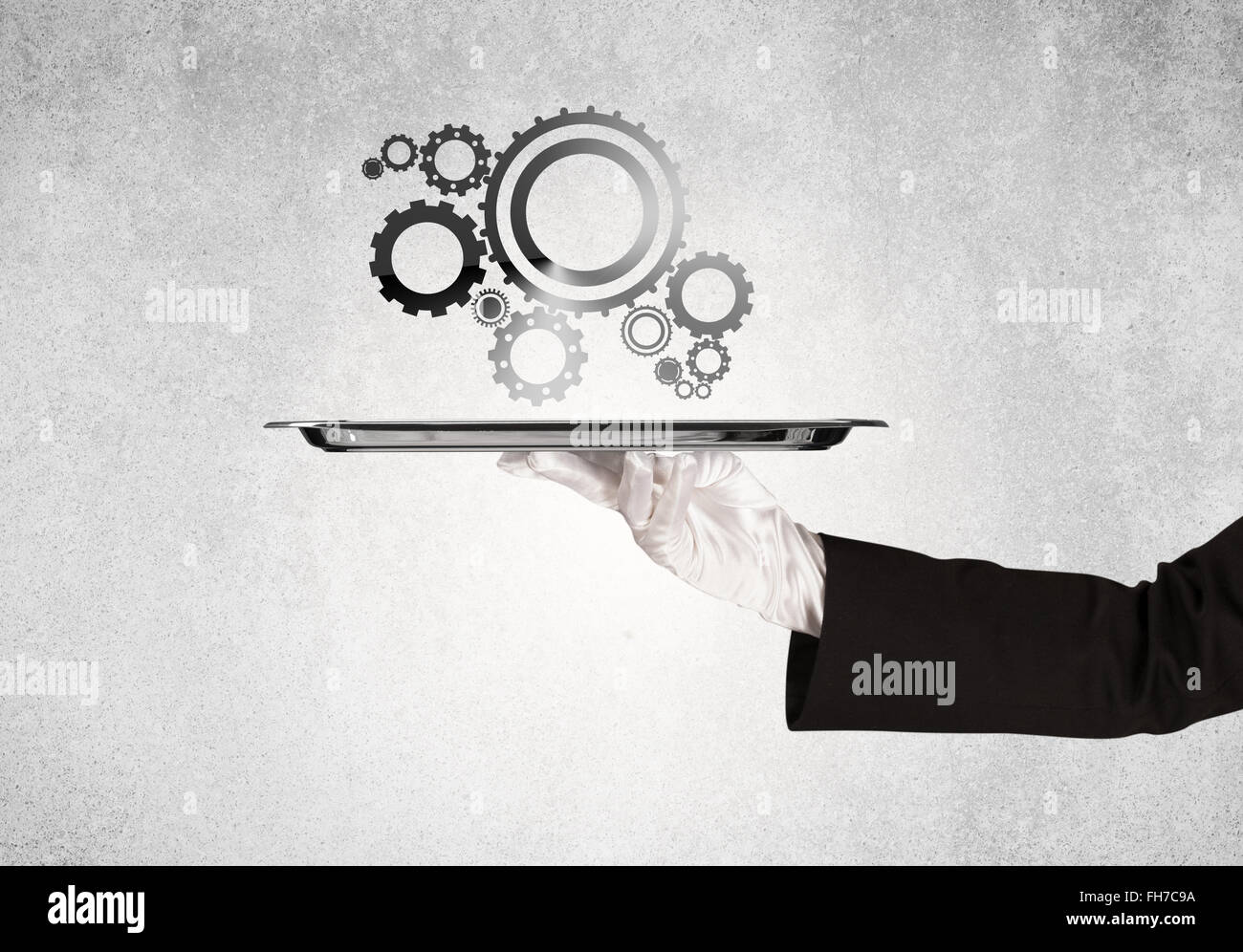 Working cog wheel concept on tray Stock Photo - Alamy