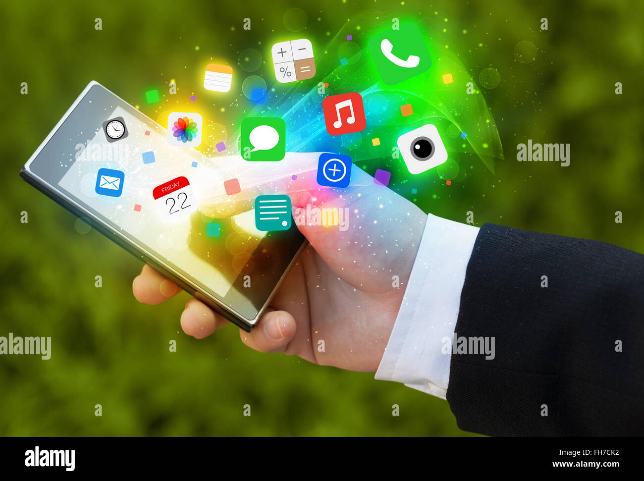 Hand holding smartphone with colorful app icons Stock Photo - Alamy
