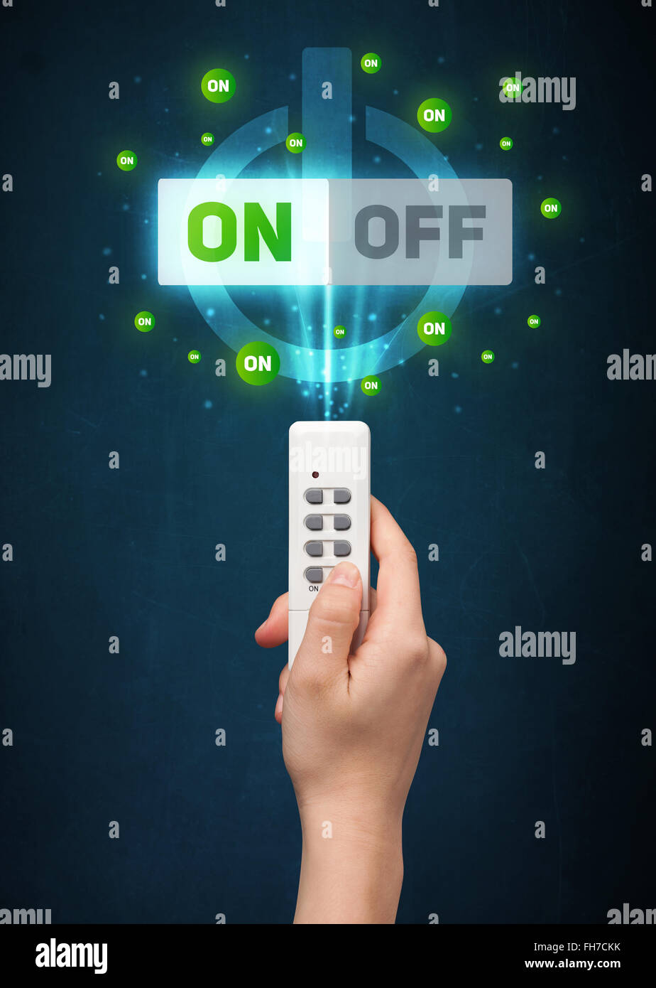 Hand with remote control and on-off signals Stock Photo - Alamy