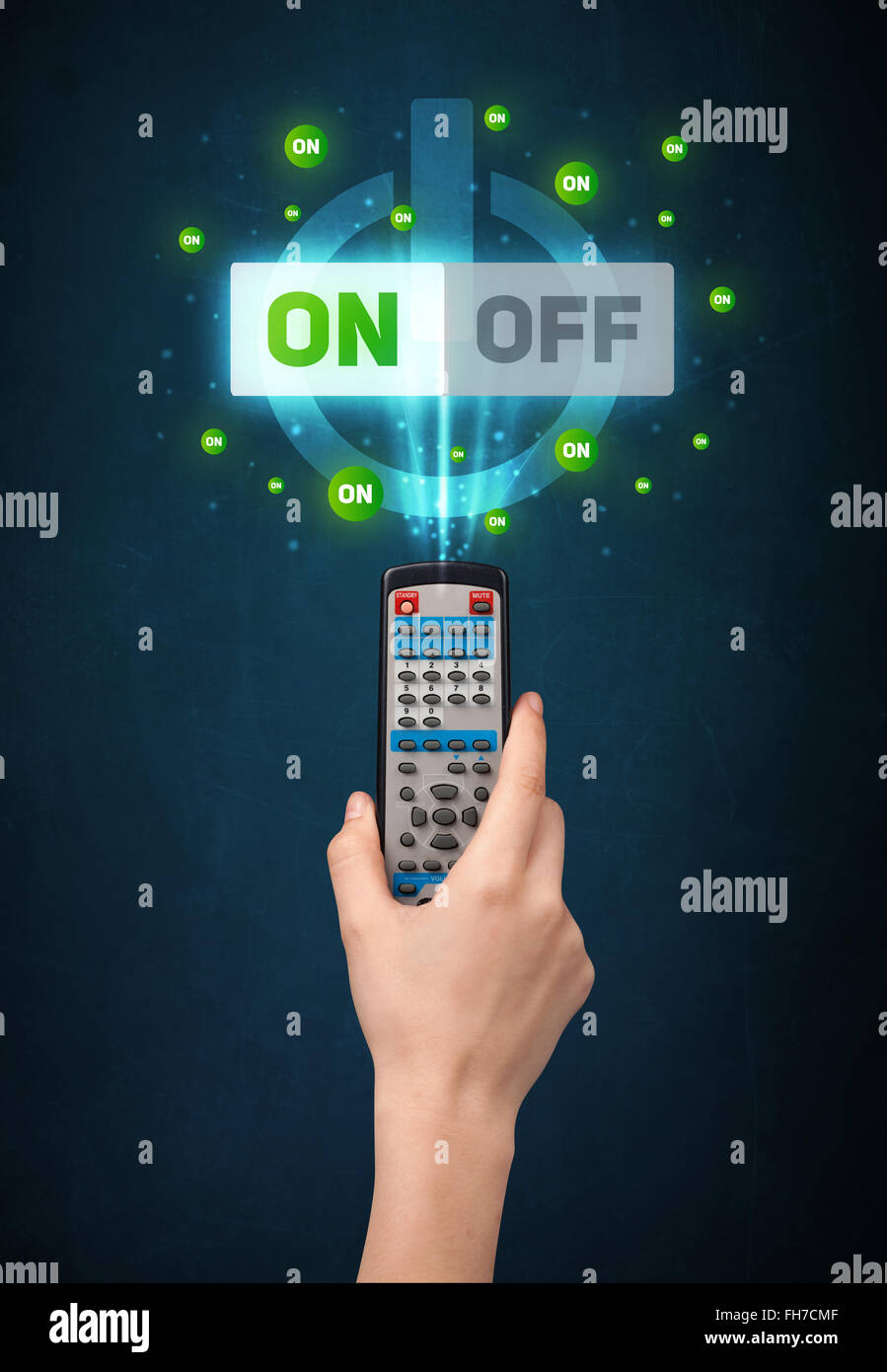 Hand with remote control and on-off signals Stock Photo - Alamy