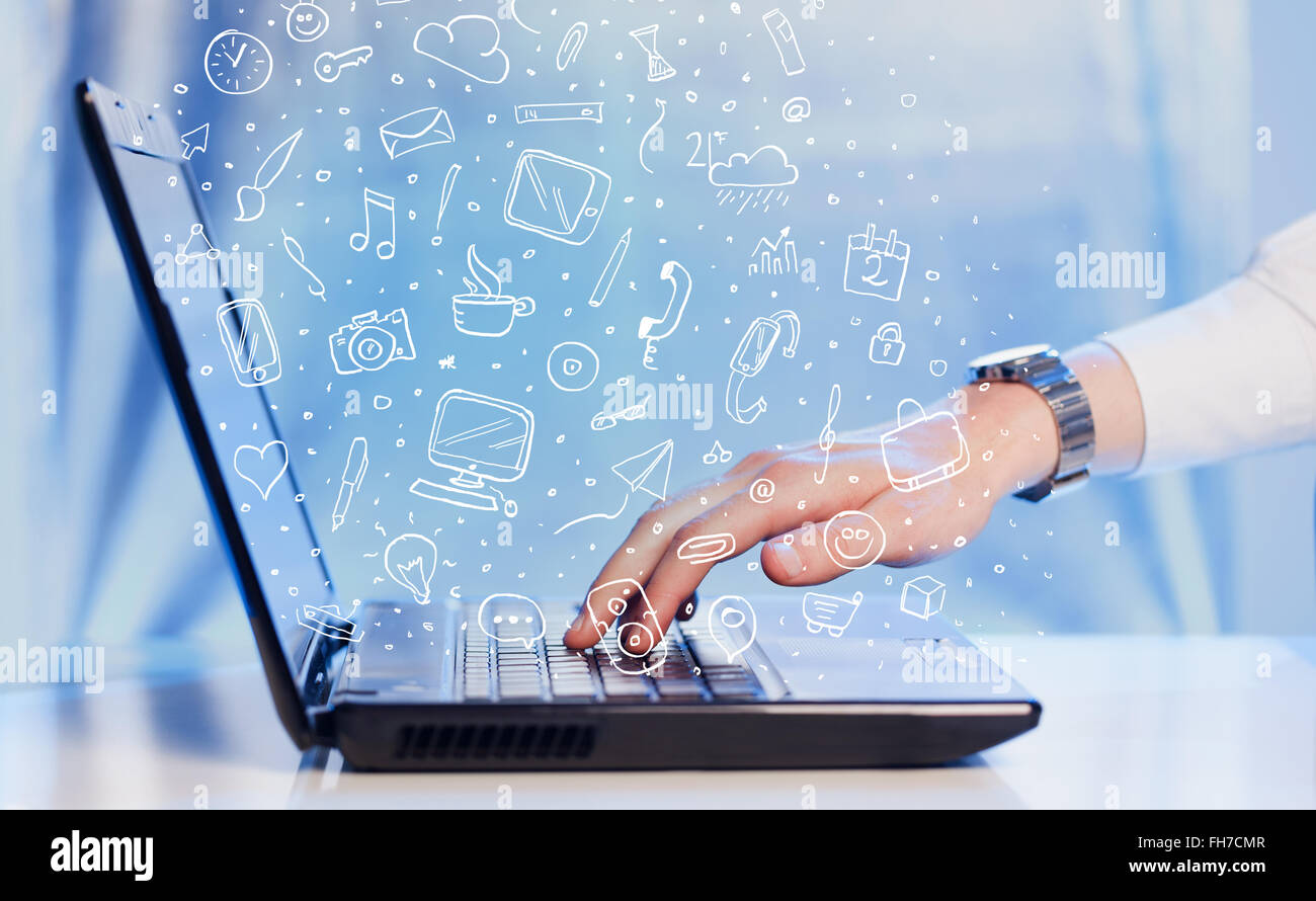 Laptop computer wtih hand drawn icons and symbols Stock Photo - Alamy