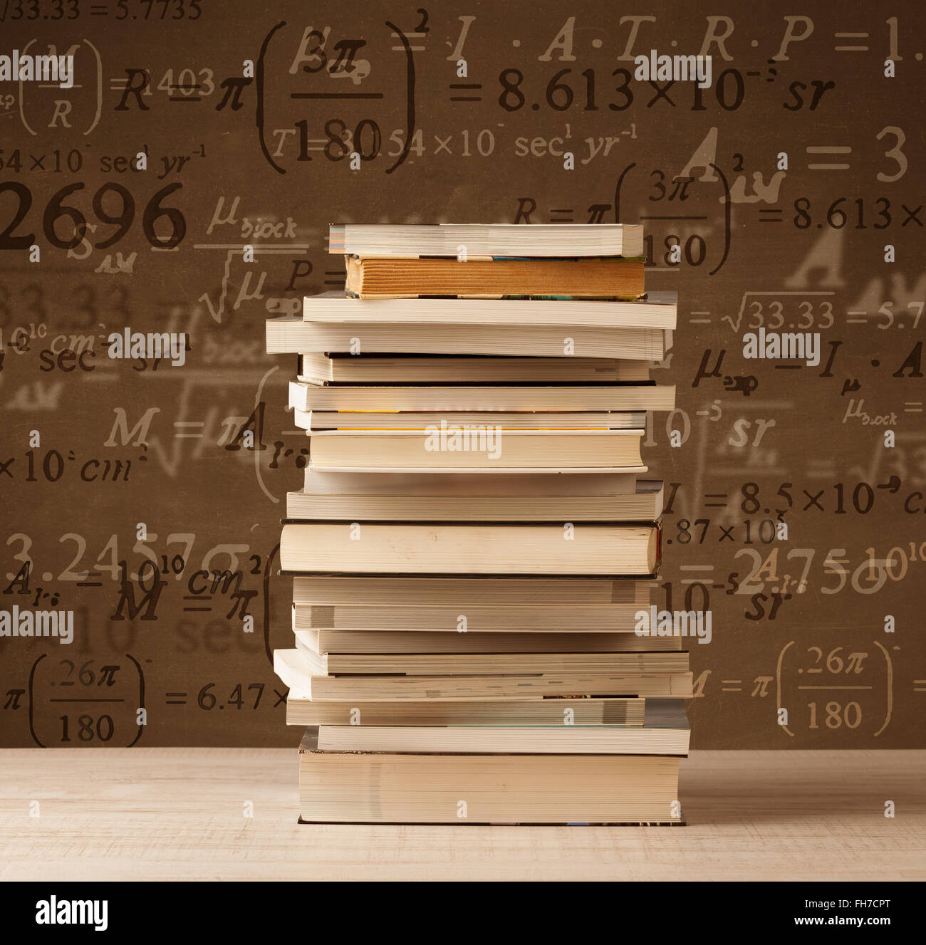 Books on vintage background with math formulas Stock Photo - Alamy