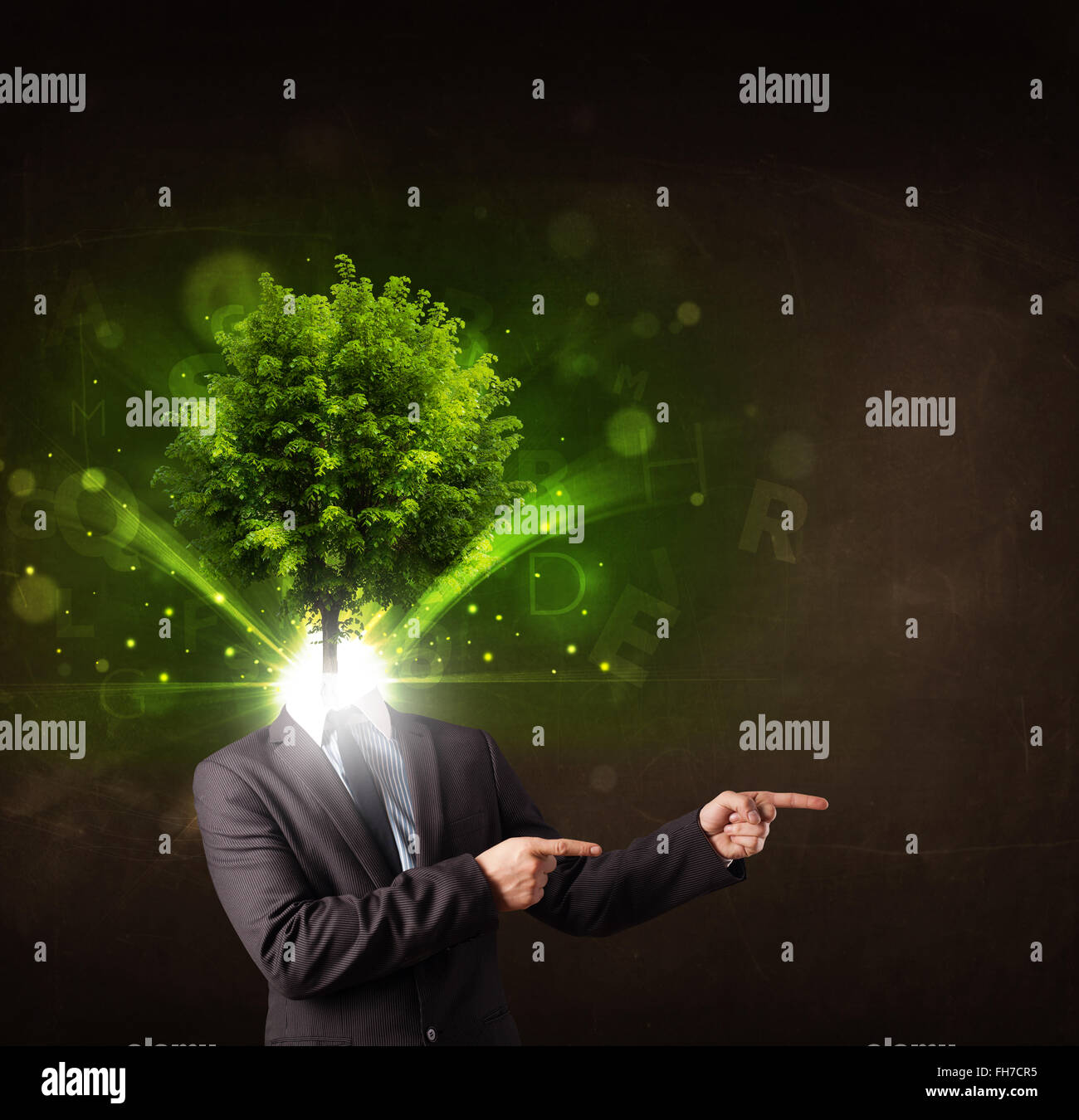 Man with green tree head concept Stock Photo - Alamy