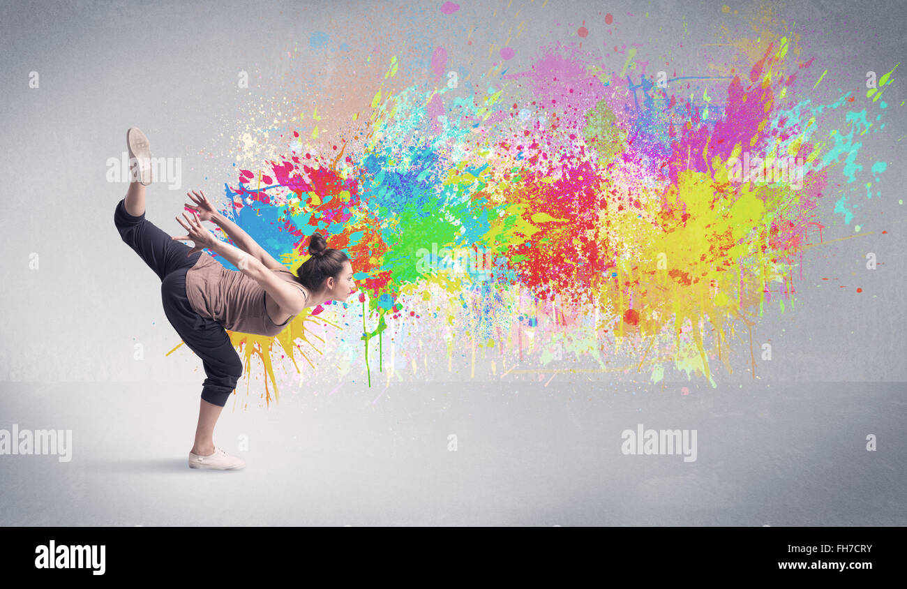 Young colorful street dancer with paint splash Stock Photo - Alamy