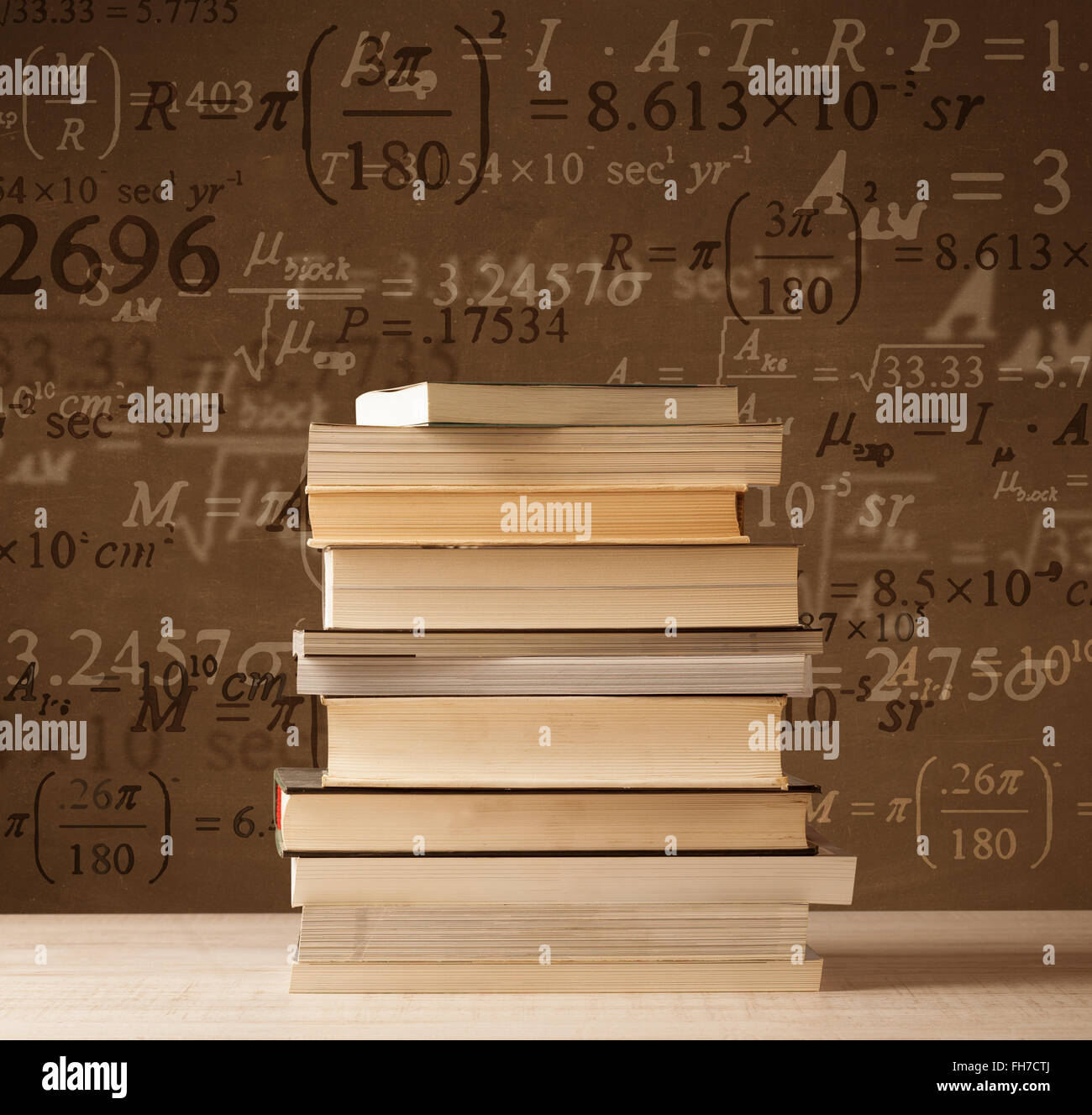 Books on vintage background with math formulas Stock Photo - Alamy