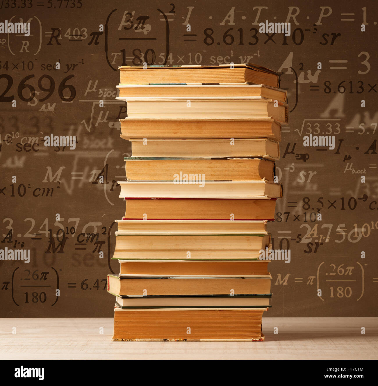 Books on vintage background with math formulas Stock Photo - Alamy