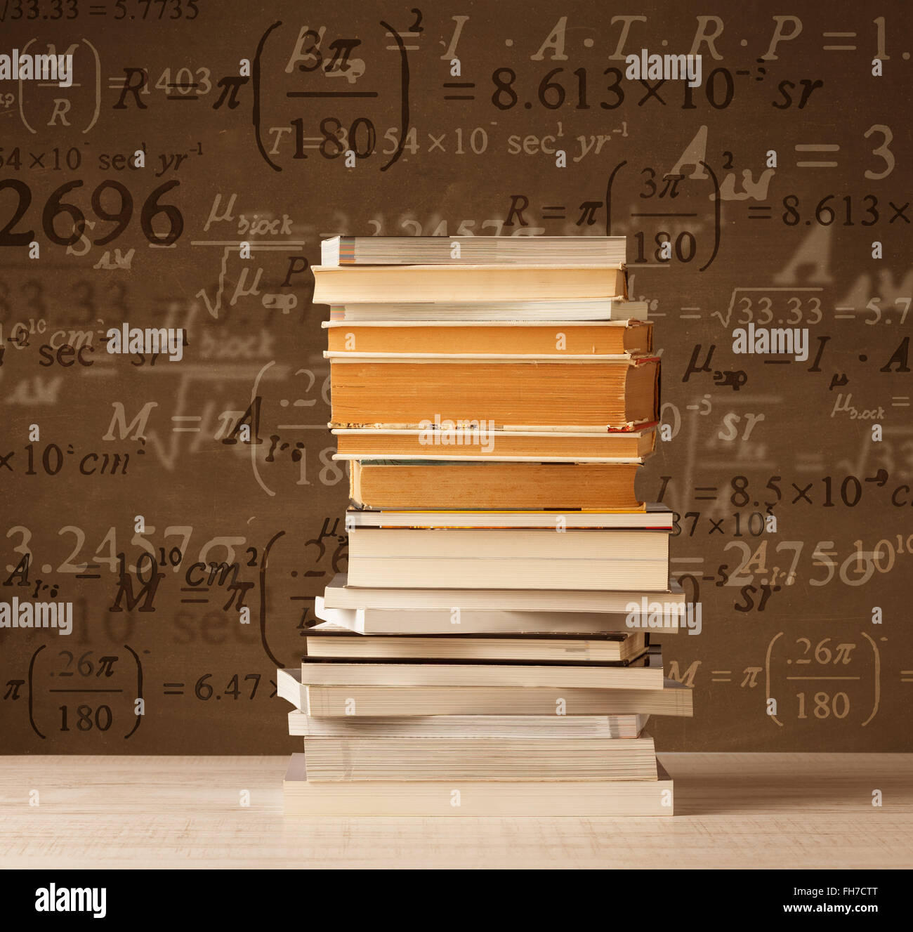 Books on vintage background with math formulas Stock Photo - Alamy