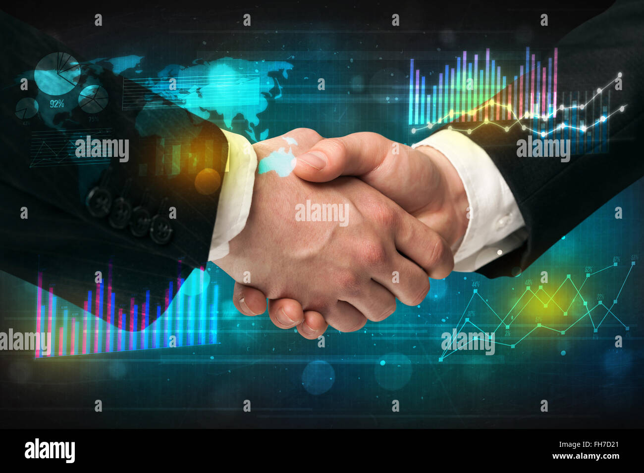 Handshake with diagrams Stock Photo - Alamy