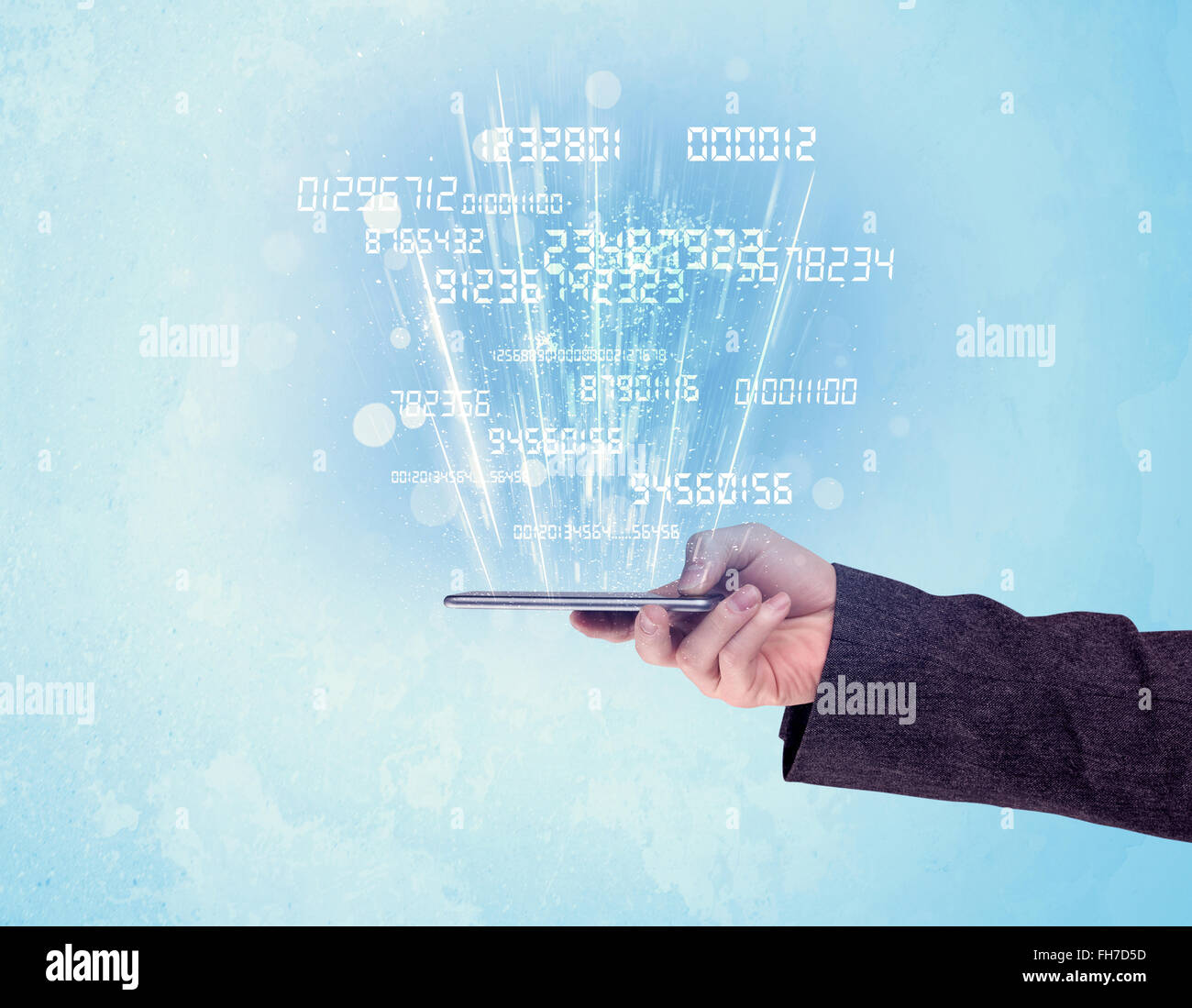 Hand holding phone with digital numbers Stock Photo - Alamy