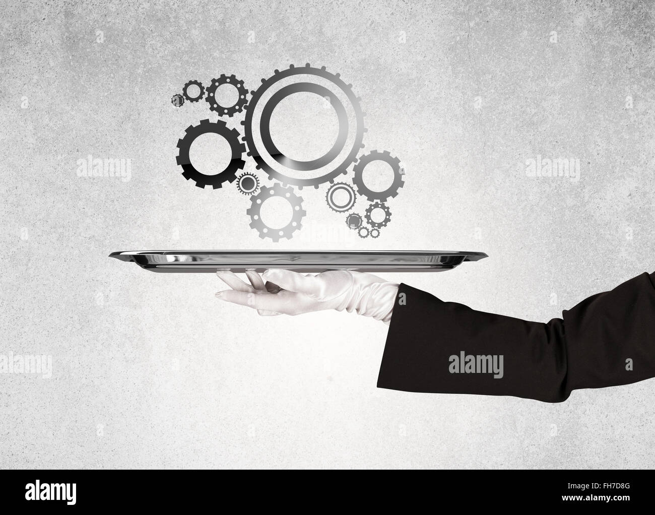 Working cog wheel concept on tray Stock Photo - Alamy