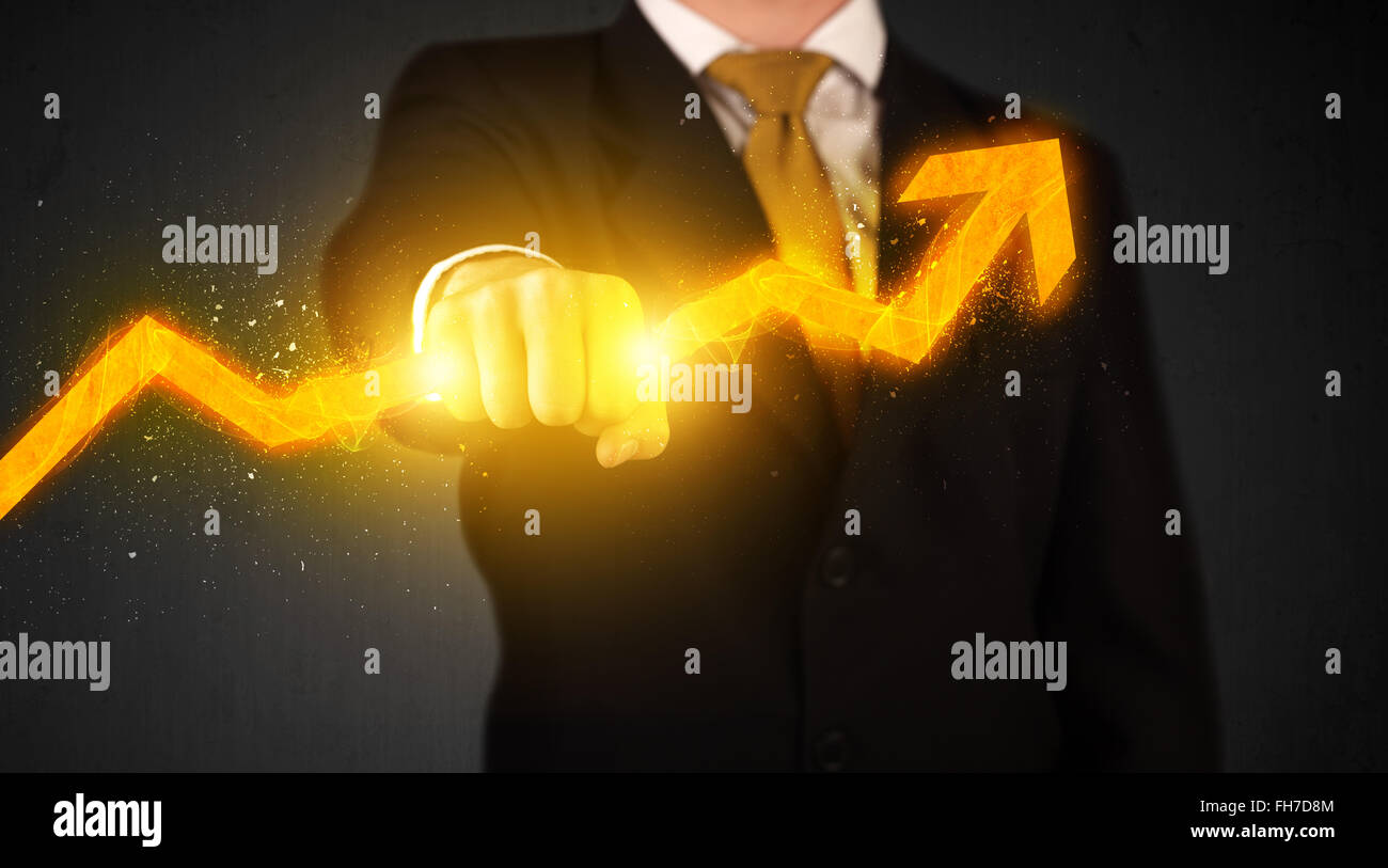 Business person holding a hot glowing upright arrow Stock Photo - Alamy