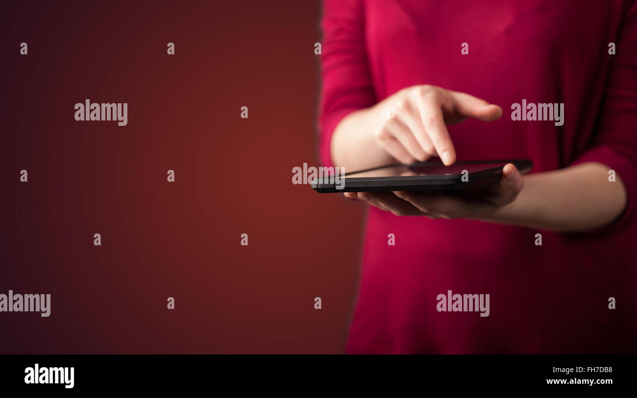 Close up of hand holding digital touchpad tablet device Stock Photo - Alamy