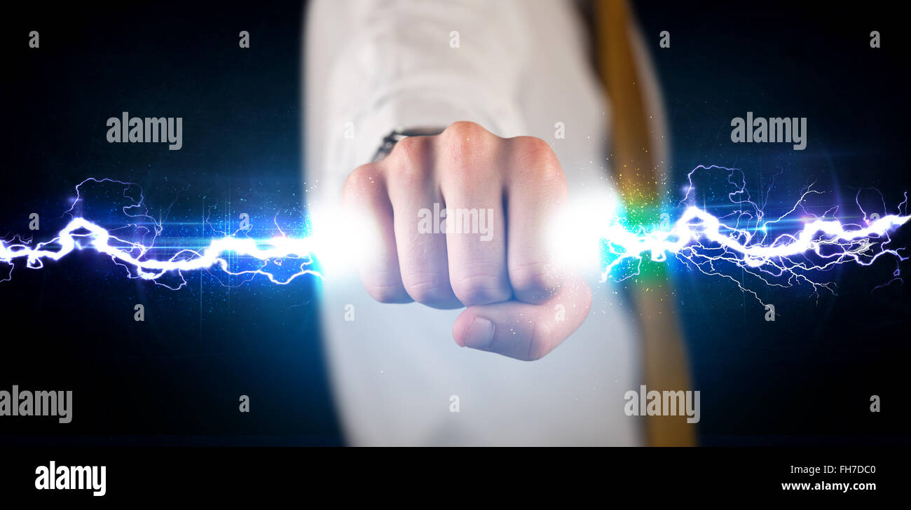Business man holding electricity light bolt in his hands Stock Photo ...