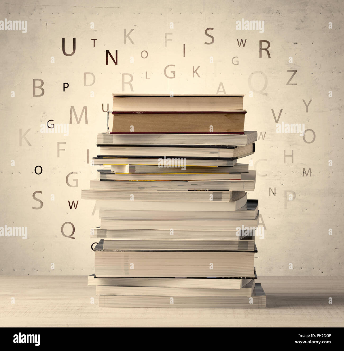 Books with flying letters on vintage background Stock Photo - Alamy