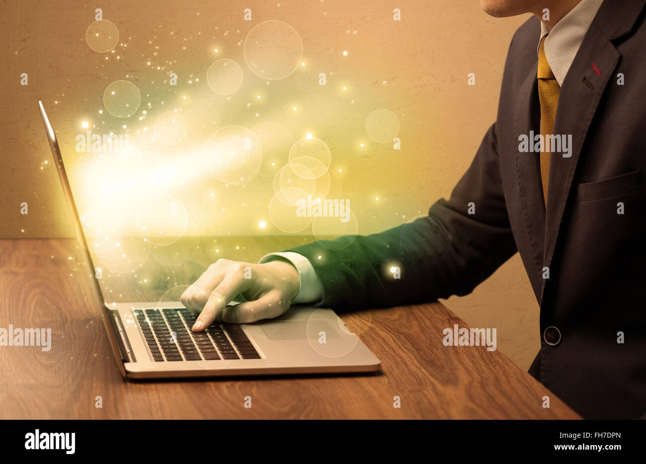 Businessman working fast on laptop Stock Photo - Alamy