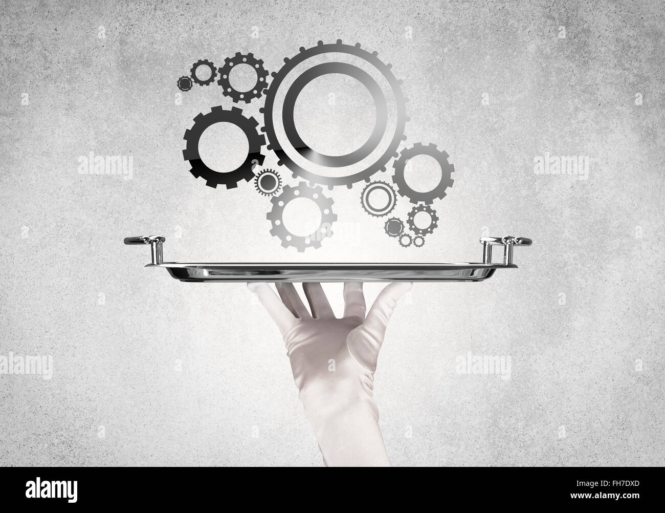 Working cog wheel concept on tray Stock Photo - Alamy
