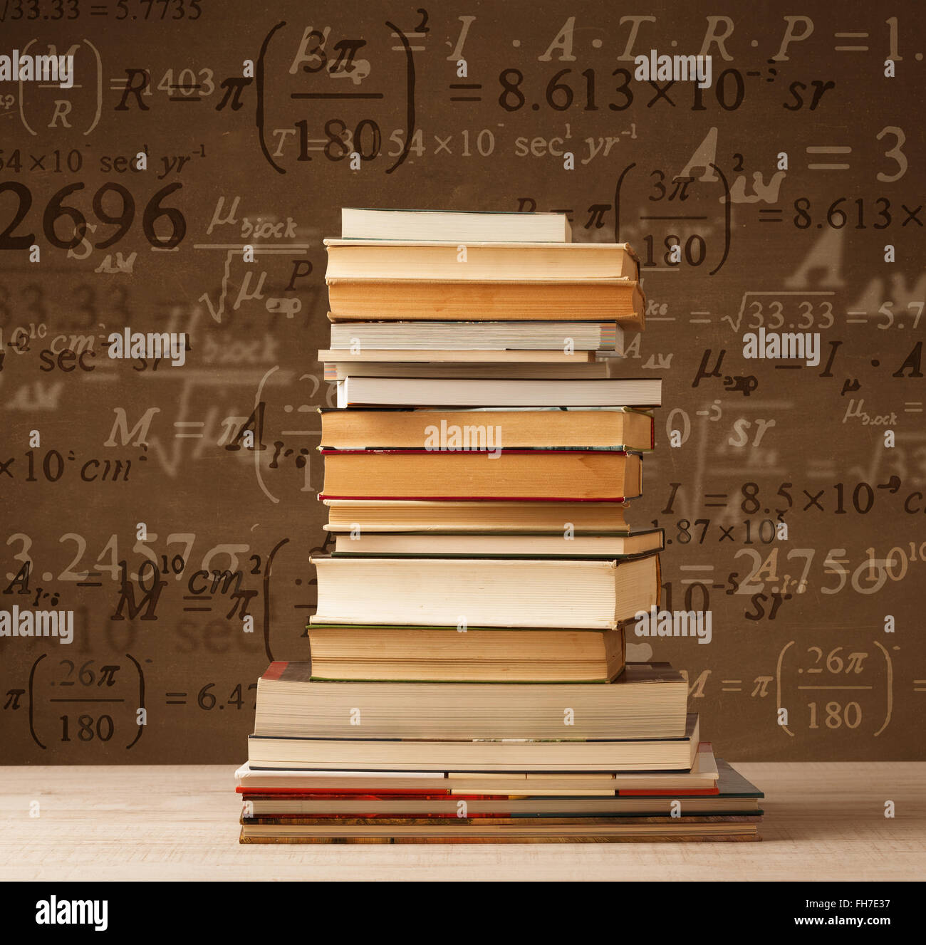 Books on vintage background with math formulas Stock Photo - Alamy