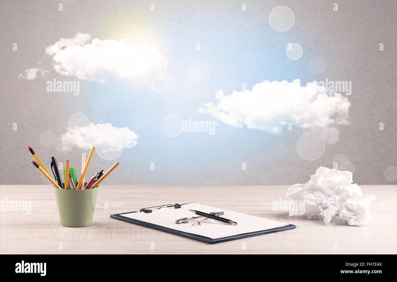 Bright sky with clouds and office desk Stock Photo - Alamy