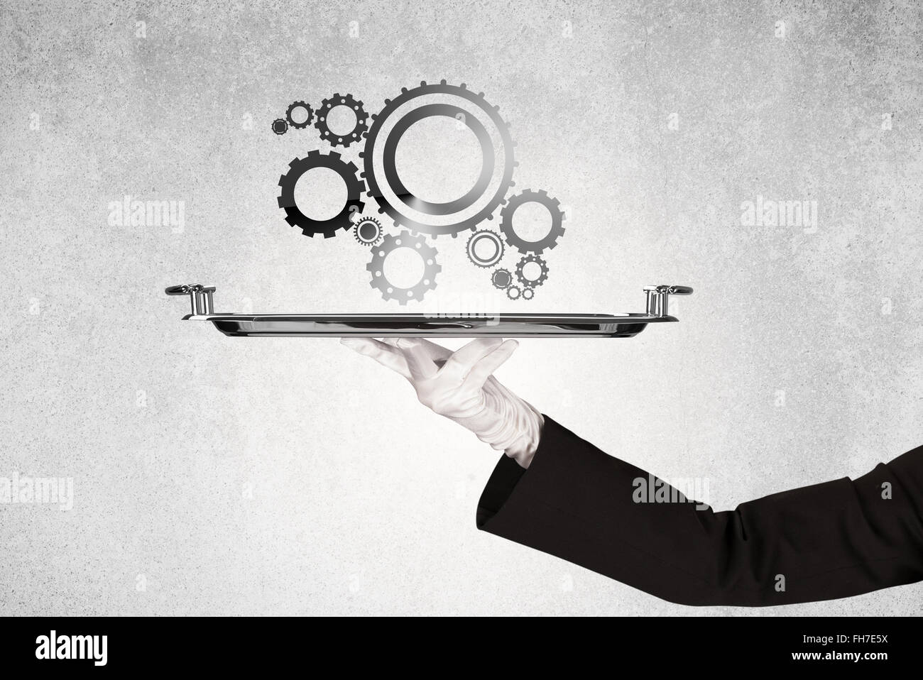 Working cog wheel concept on tray Stock Photo - Alamy