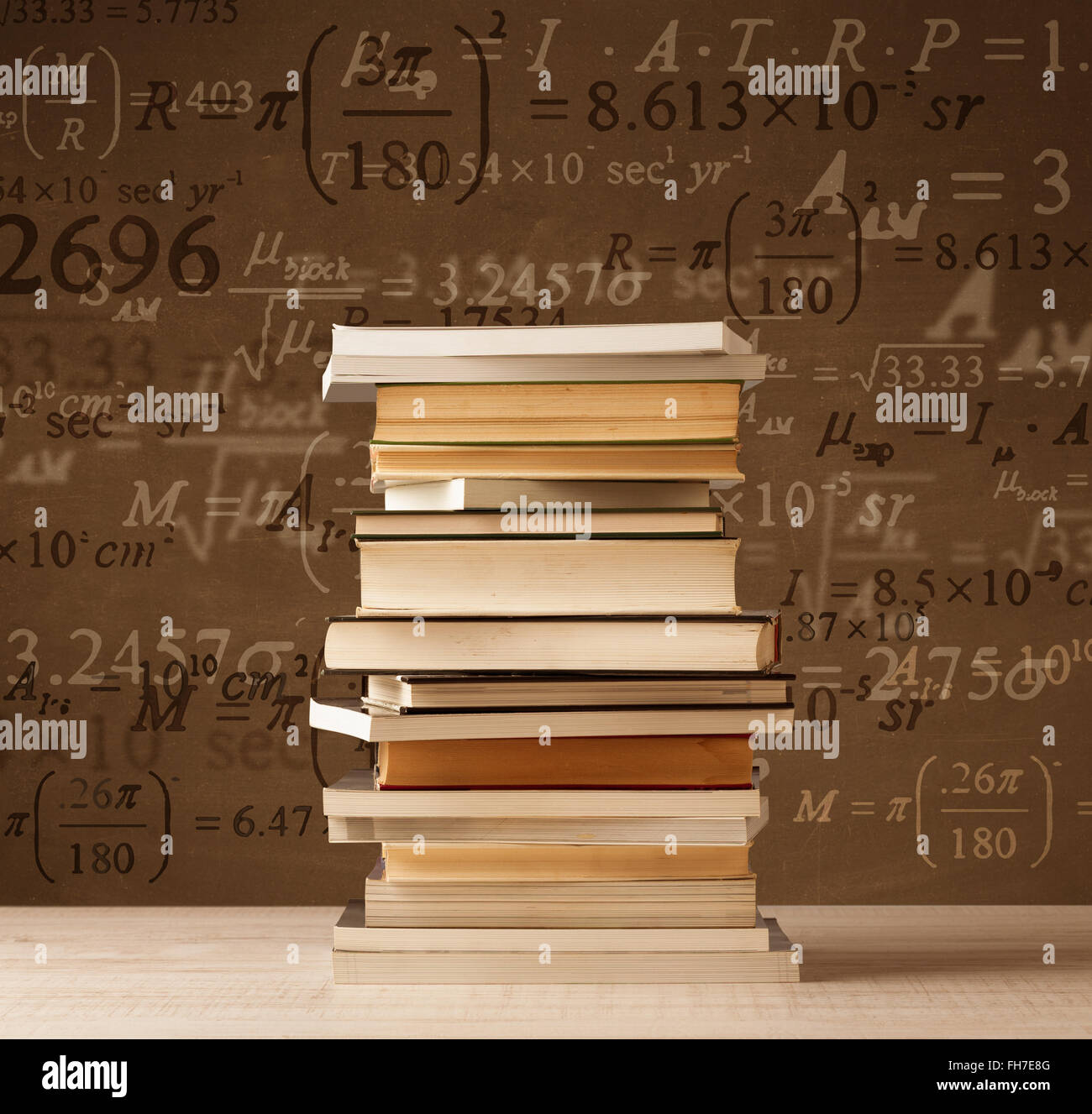 Books on vintage background with math formulas Stock Photo - Alamy
