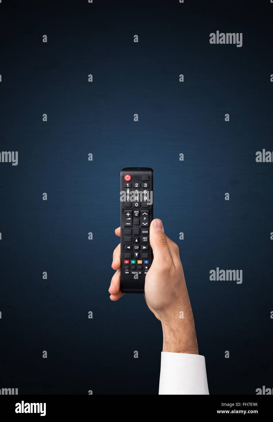 Hand with remote control Stock Photo - Alamy