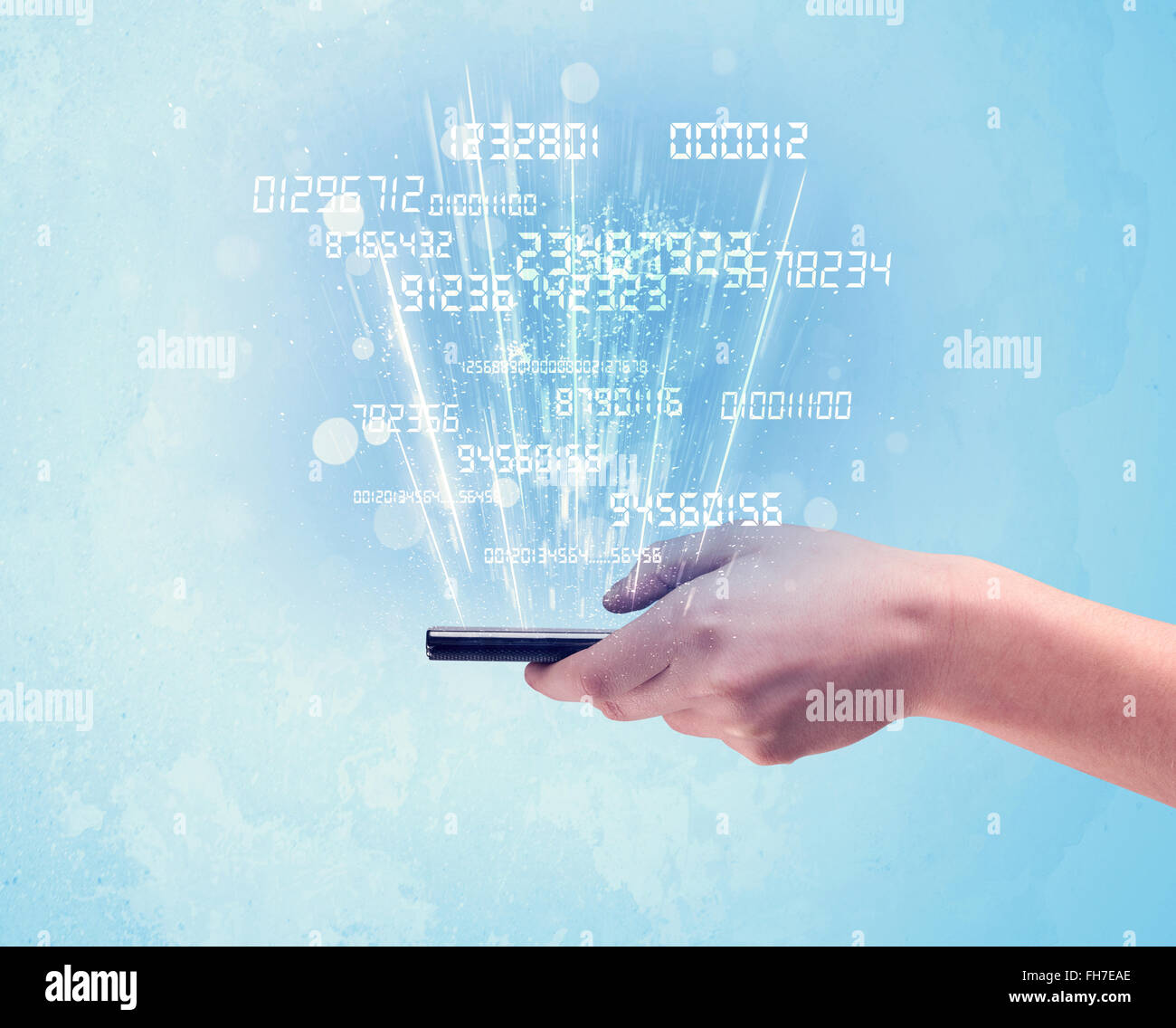 Hand holding phone with digital numbers Stock Photo - Alamy