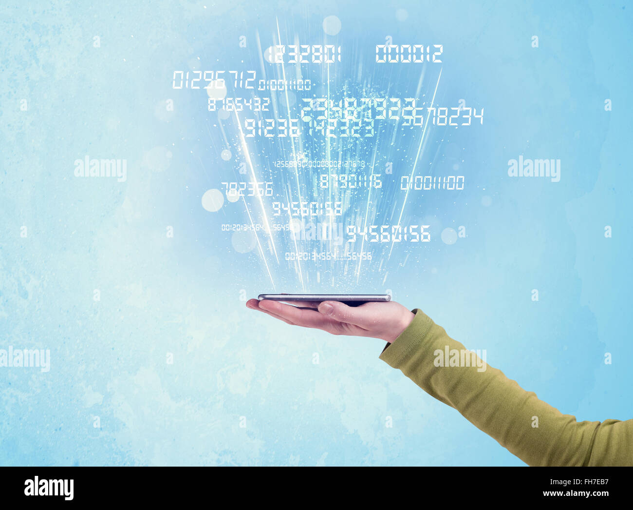 Hand holding phone with digital numbers Stock Photo - Alamy
