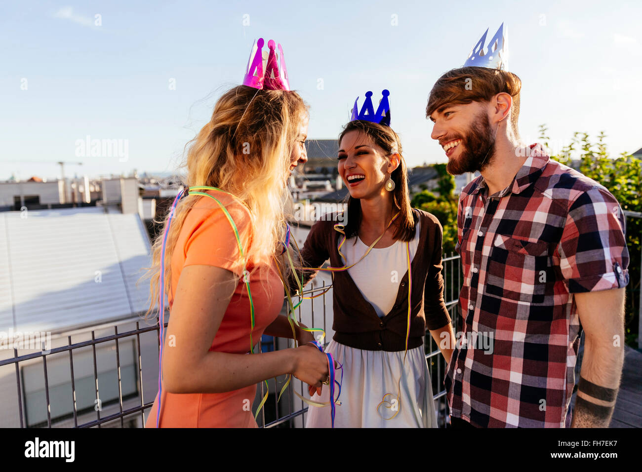 Austria, Vienna, Young people having a party on rooftop terrace Stock ...
